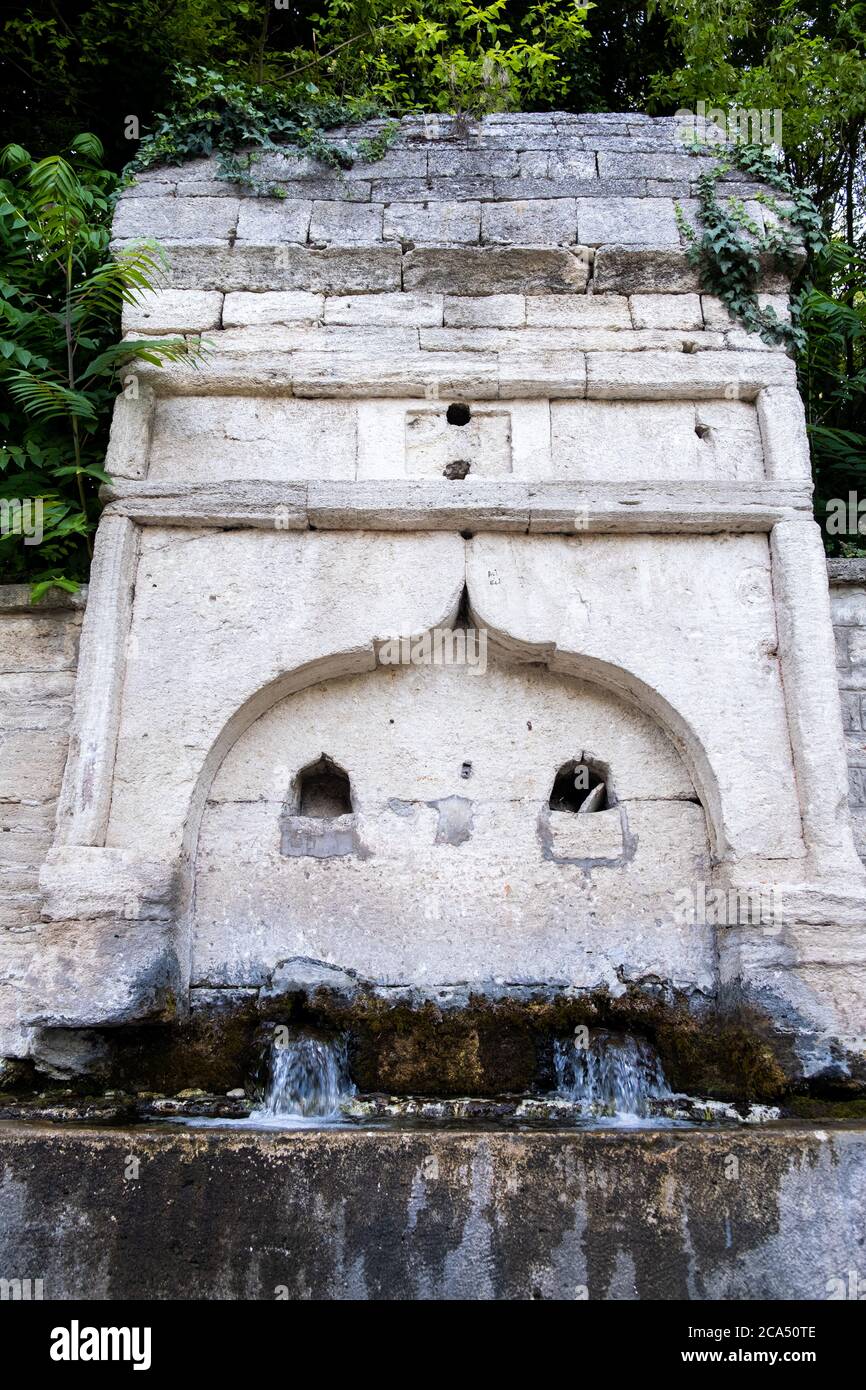 Front of Stone Drinking Fountain with water from the middle ages Stock ...
