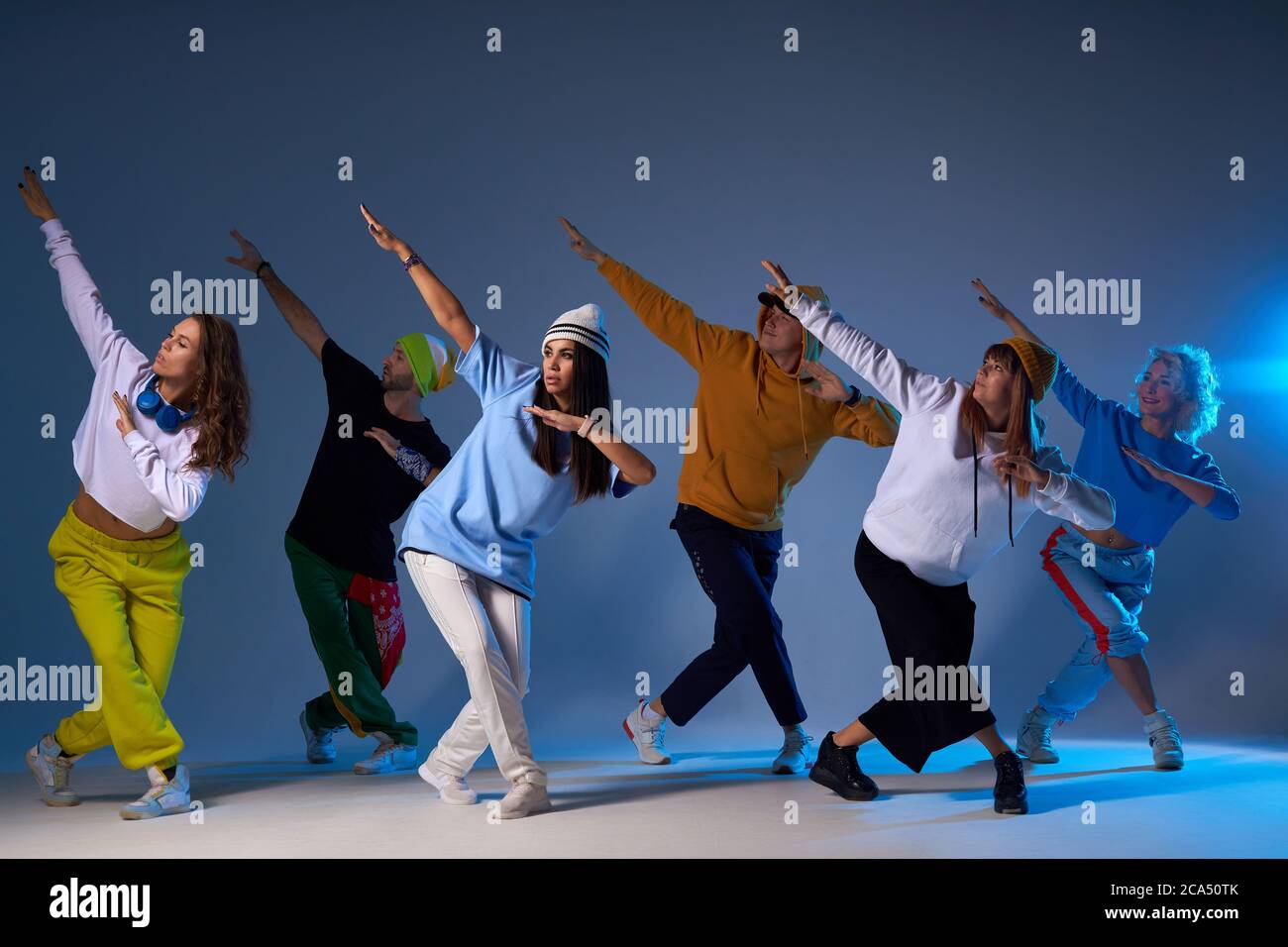 Famous group performing on concert, moving synchronically, making house ...