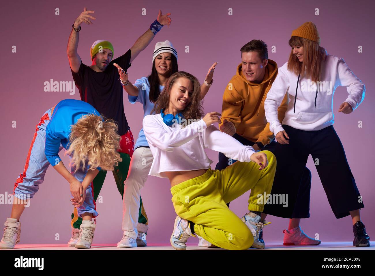 Extremely positive photo of joyful young dancers yelling with pleasure ...