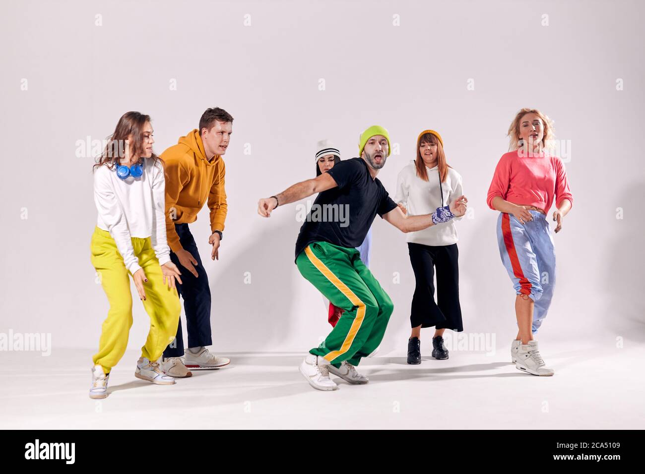 Active male dance trainer showing movie of hip hop dance, loving to ...