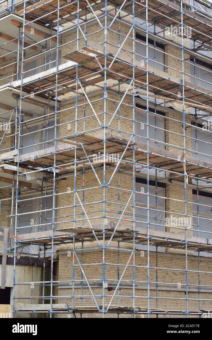 Construction scaffolding on the facade of a residential building. Day ...