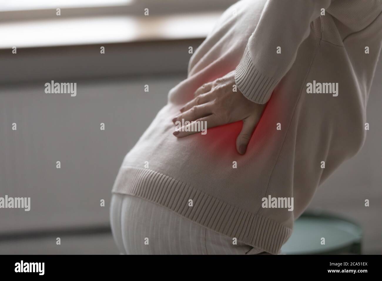 Old woman put hand on back relieving ache feels backpain Stock Photo ...