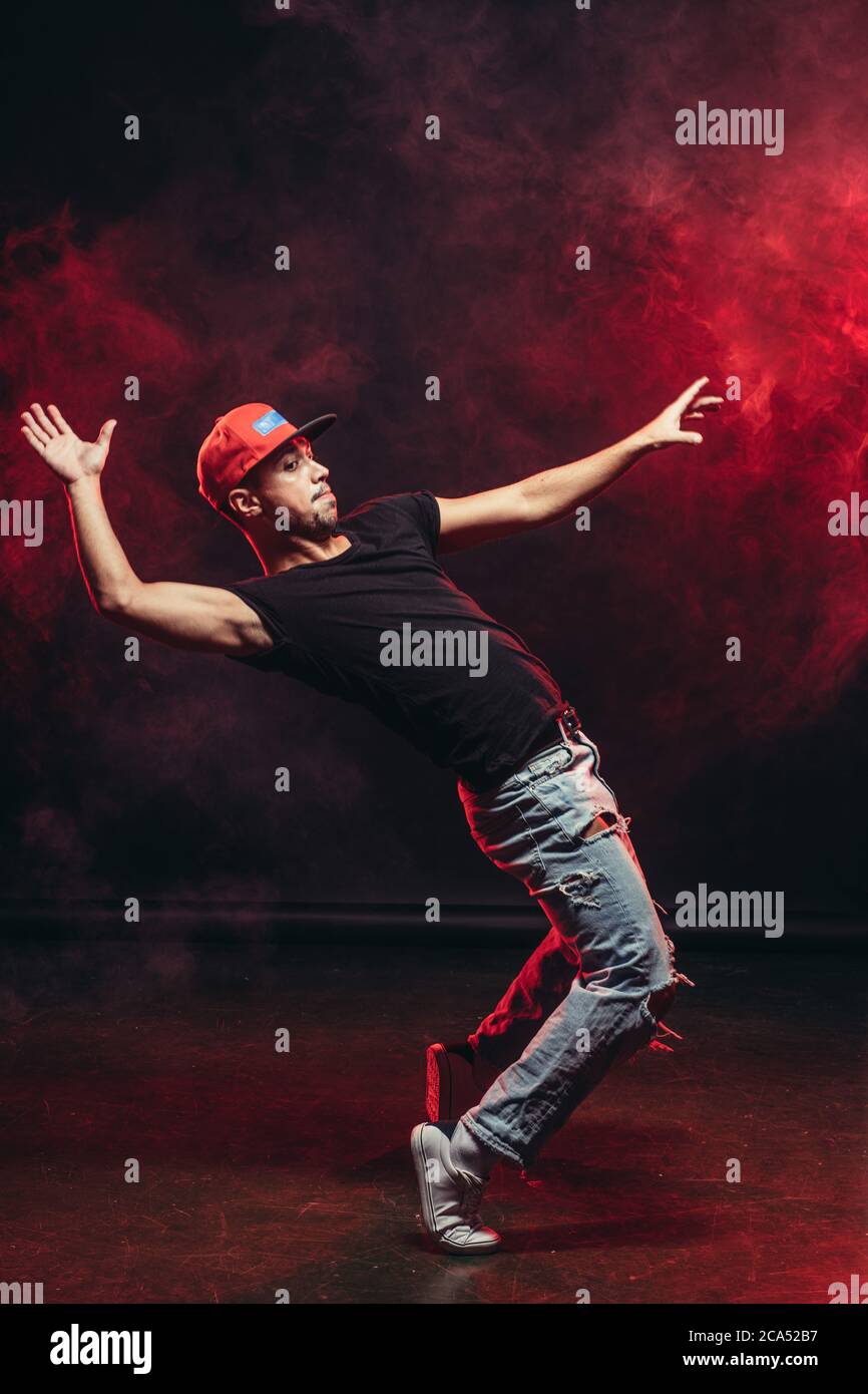 Young man professional dancer fond of dancing. dancing movements by ...