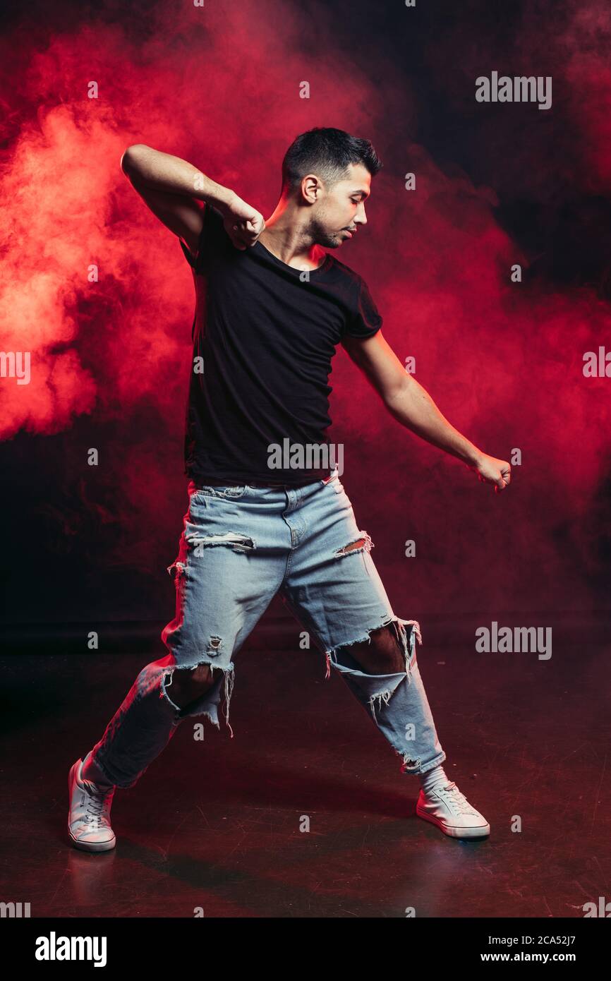 Young man professional dancer fond of dancing. dancing movements by ...