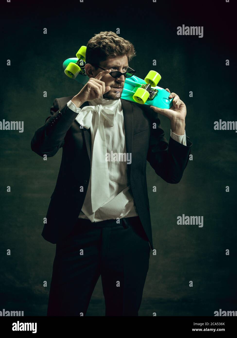 Skateboard urban style. Young man in suit as Dorian Gray isolated on ...