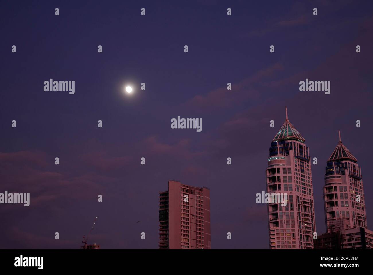 MOONRISE IN MUMBAI OVER THE IMPERIAL TOWERS WITH BEAUTIFUL COLOURS IN ...