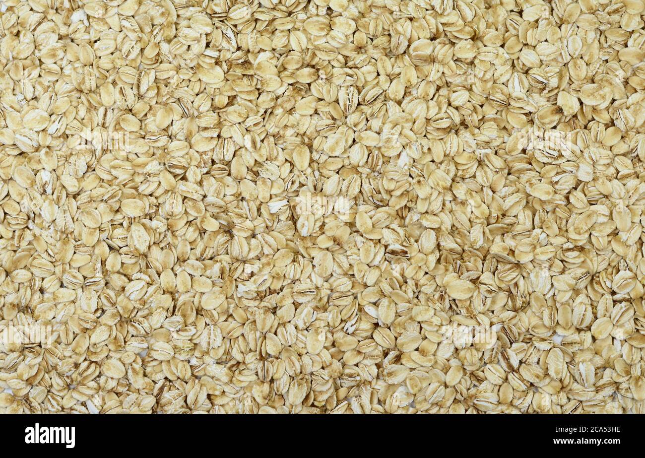 Oat flakes pile isolated on white background Stock Photo - Alamy