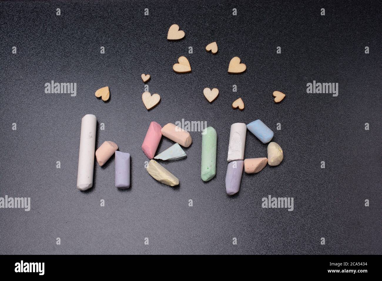 Help word written incoloured chalk on a black chalkboard Stock Photo ...