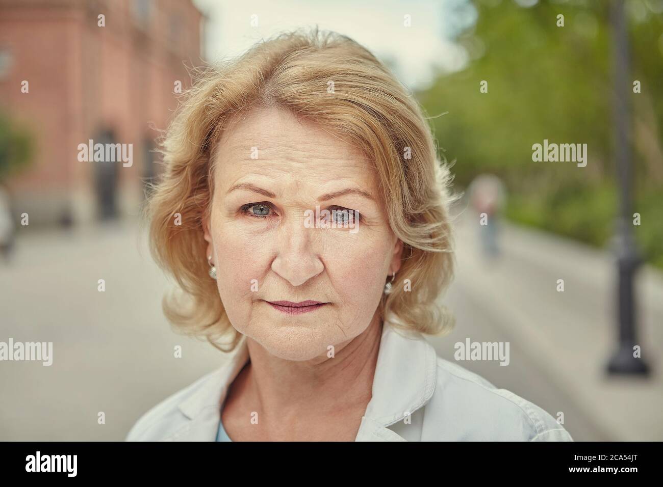 Elderly caucasian businesswoman about 62 years old with serious and ...