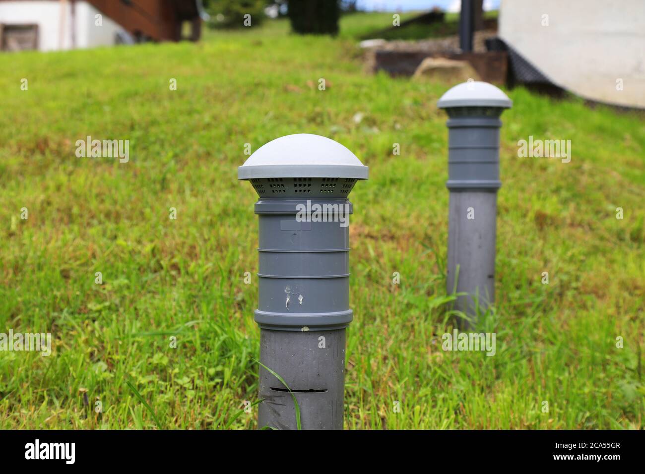 Underground septic tank vents next to a home in Poland. Septic tank ...