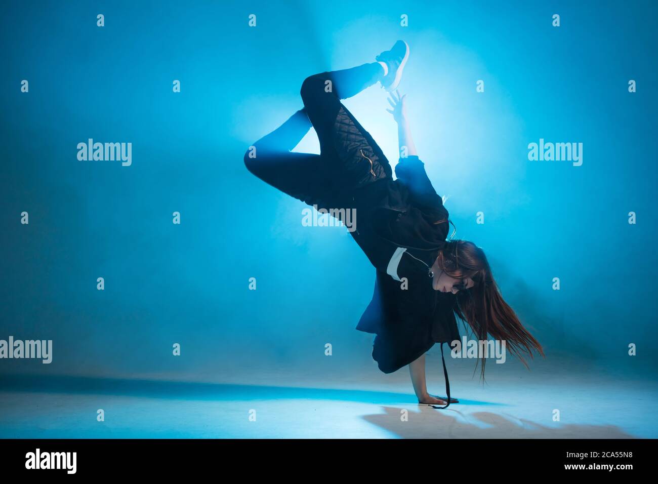 Stylish woman dancing solo on hip hop party. Sunglasses, modern black ...