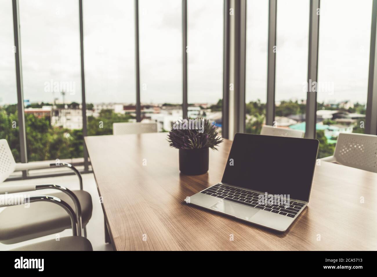 Laptop computer on the office table Stock Photo - Alamy