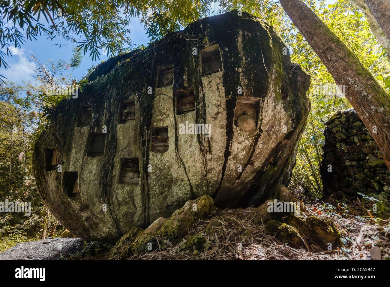 Indonesia, Sulawesi, Tana Toraja, Bori, giant rock with dug out tombs ...