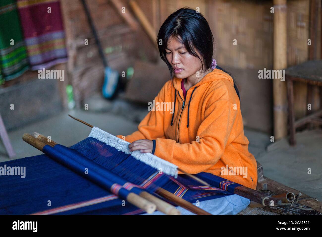Girl working on a loom hi-res stock photography and images - Alamy
