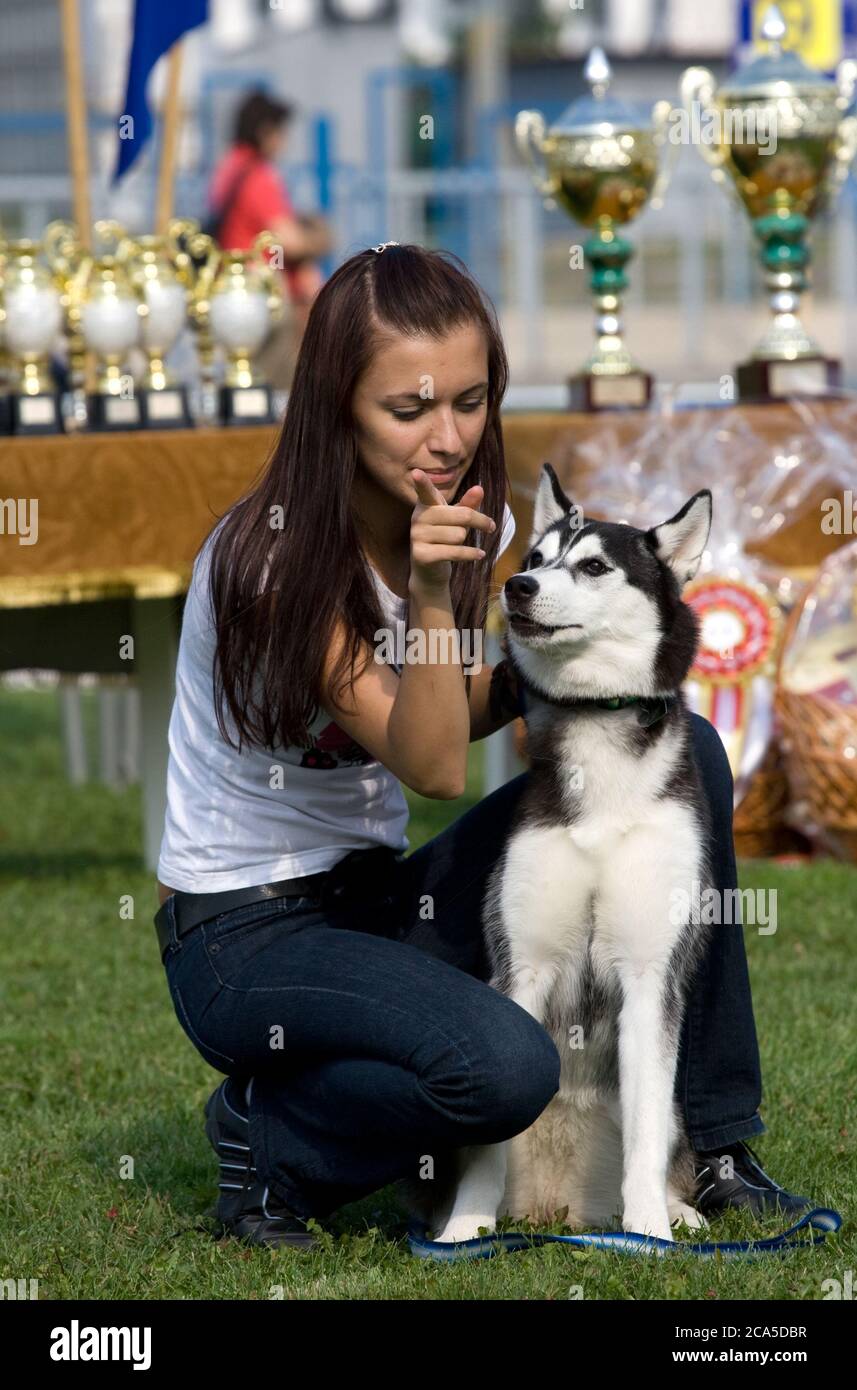 Happy owner with her siberian husky dog Stock Photo - Alamy
