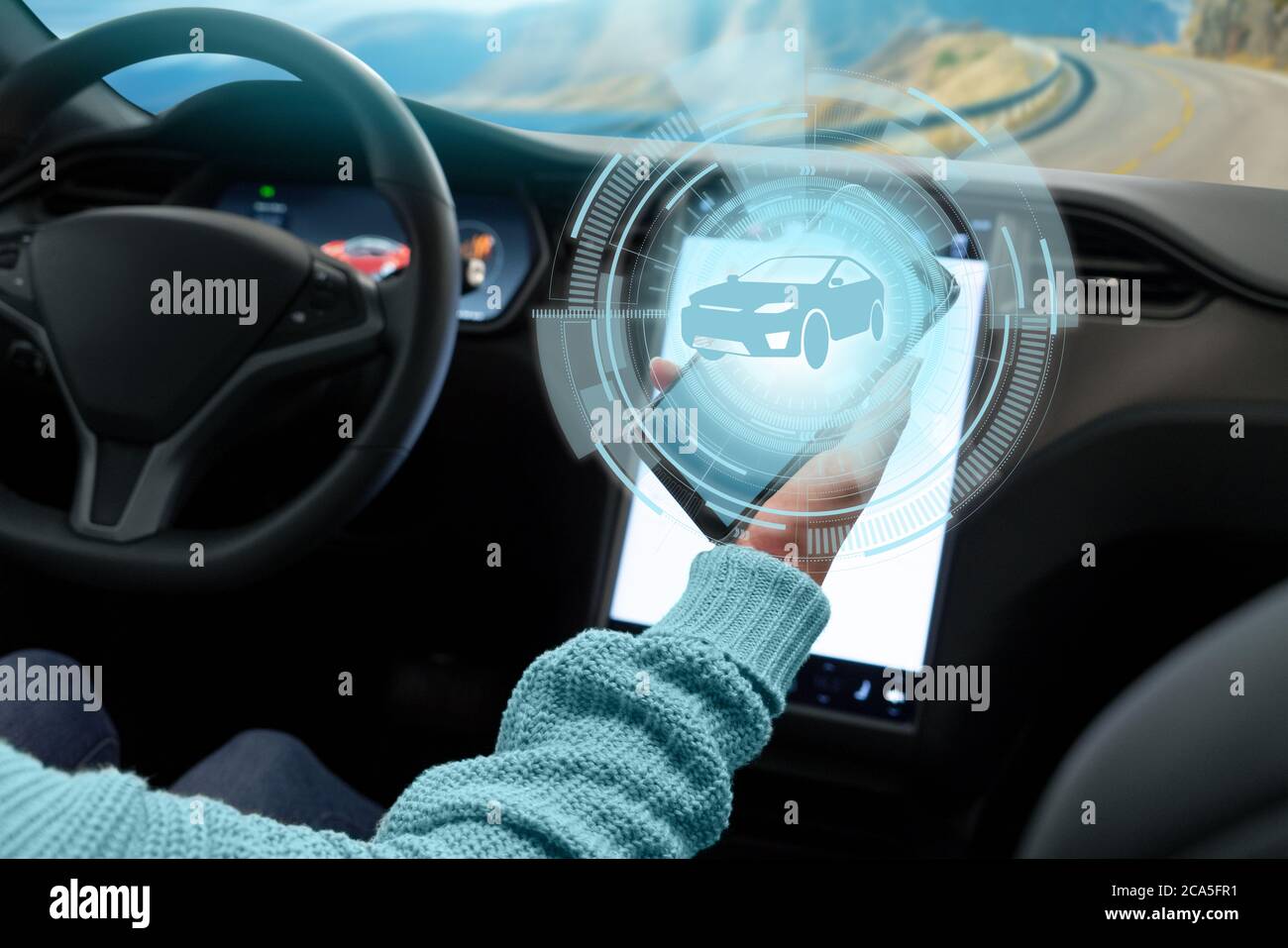 Driver controls an autonomous car using a smartphone Stock Photo - Alamy