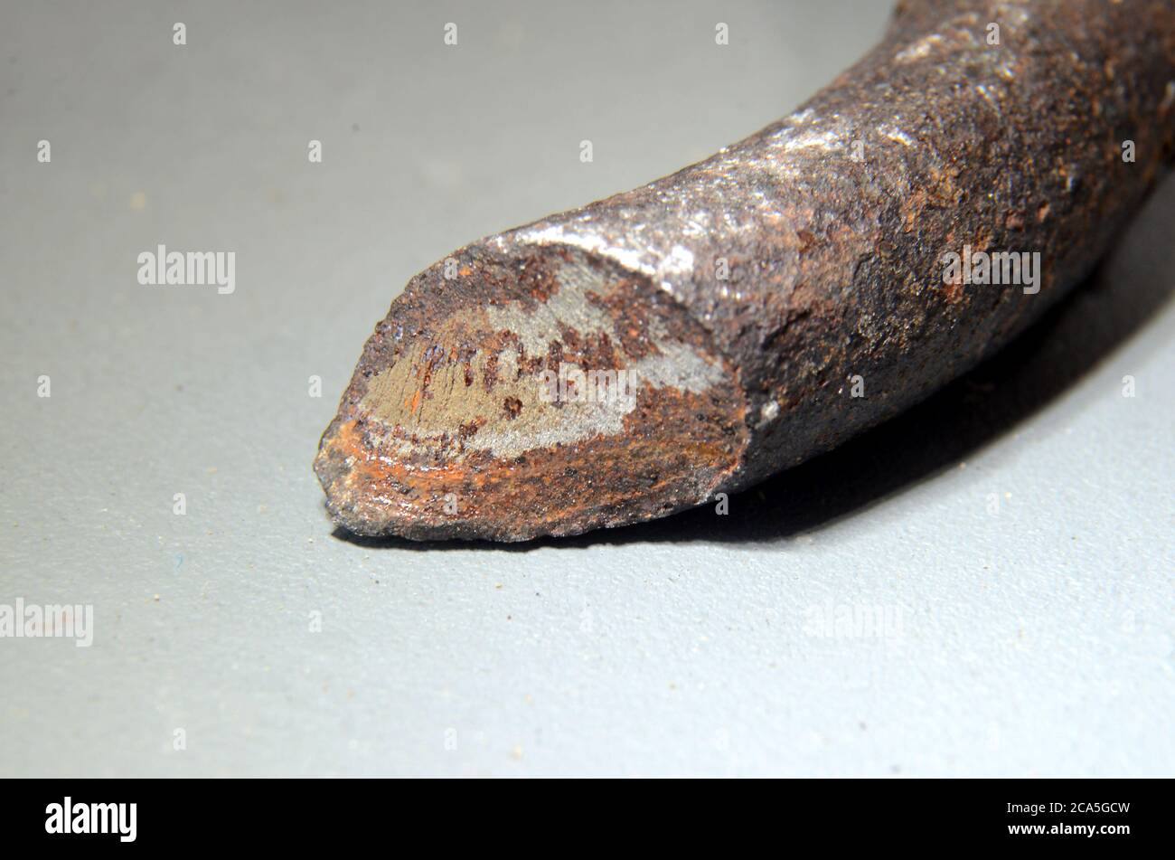 Closeup with focus on the surface of a fracture in a car spring. This ...