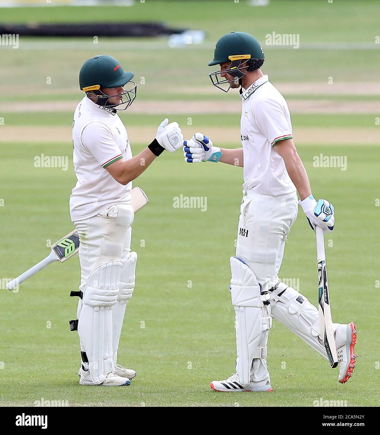 Leicestershire's Colin Ackermann (right) celebrates reaching his half ...