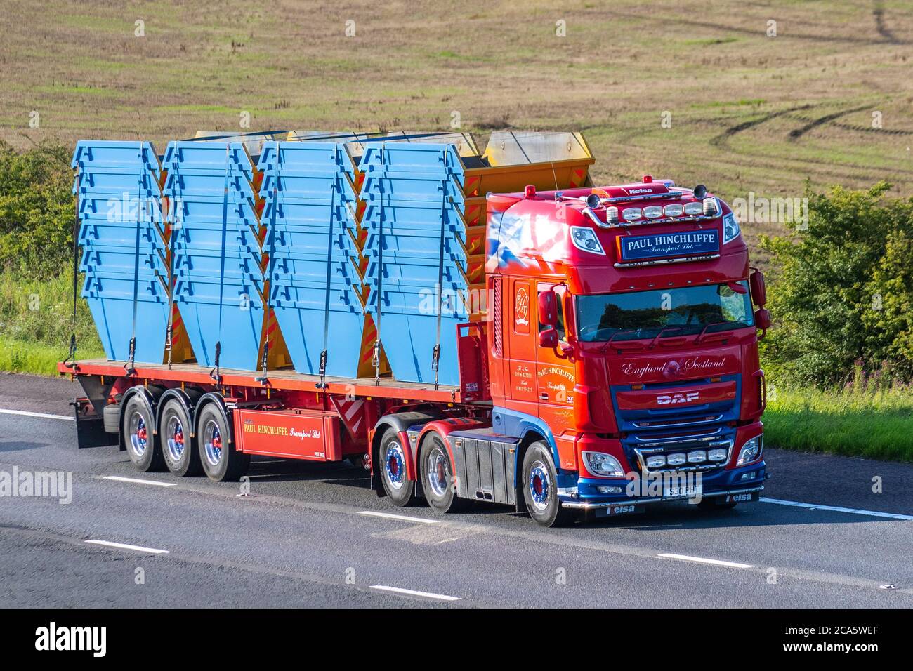Newly manufactured skips stacked on Paul Hinchliffe Transport Ltd ...