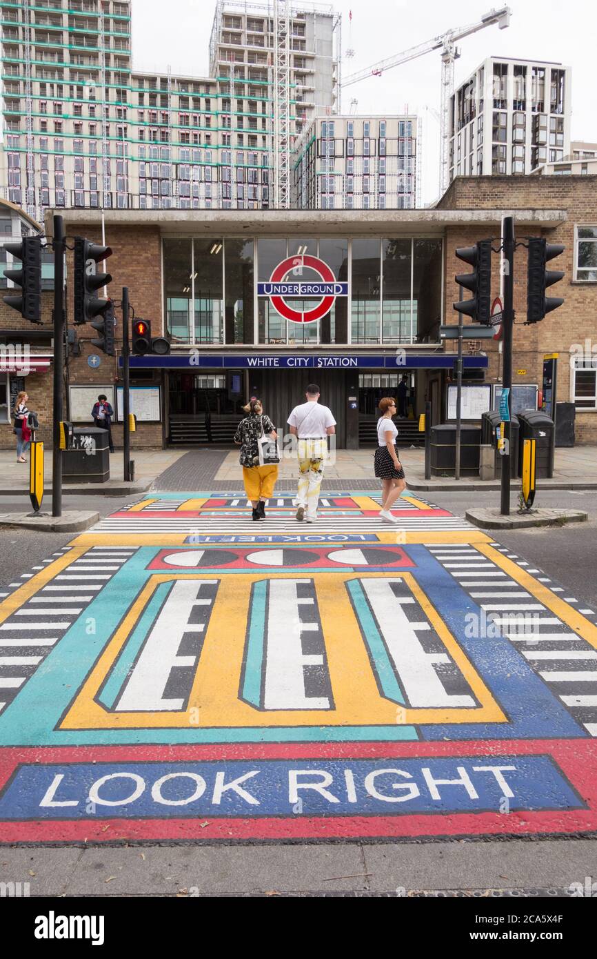 A couple crossing the road on Camille Walala's geometric pedestrian ...