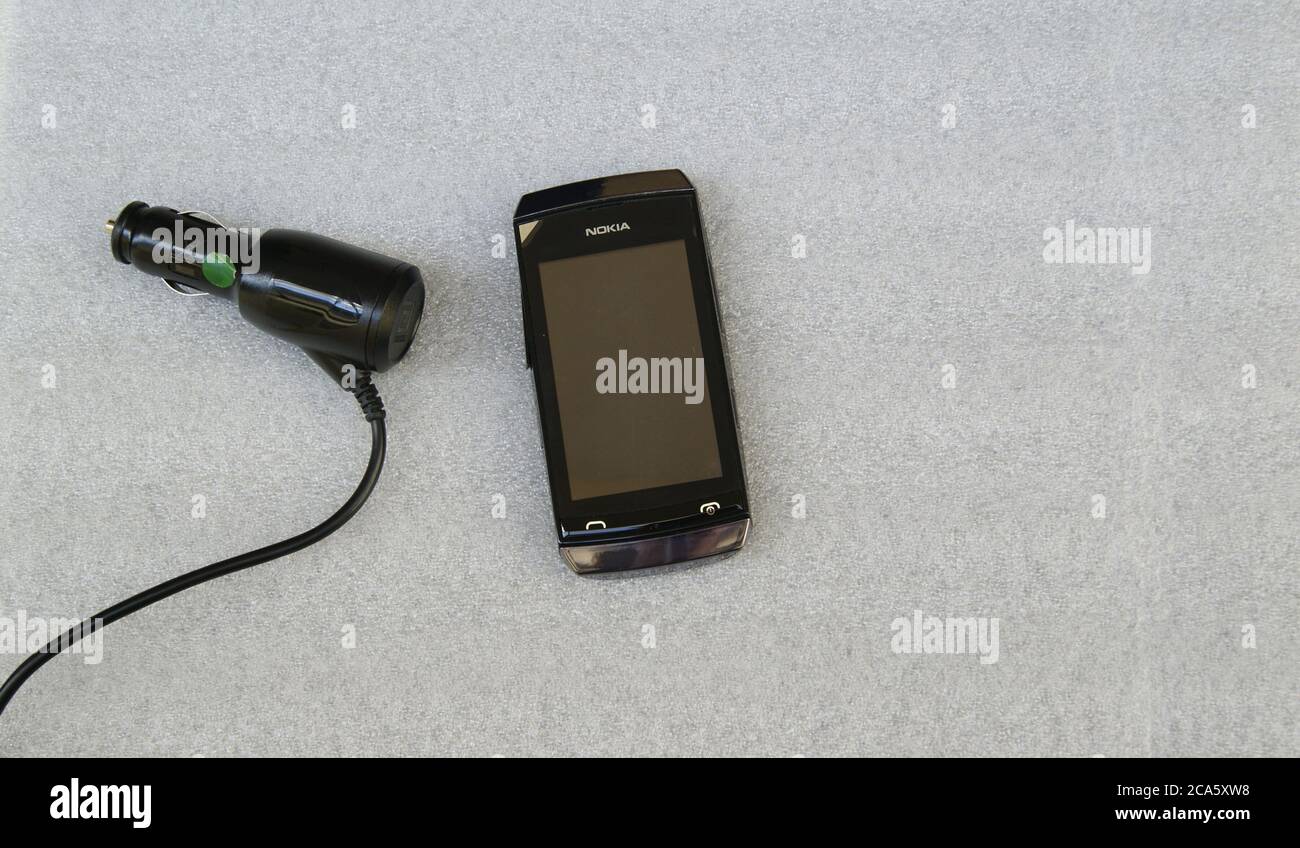 Telephone, cell phone, vintage, retro and very old in black color with ...