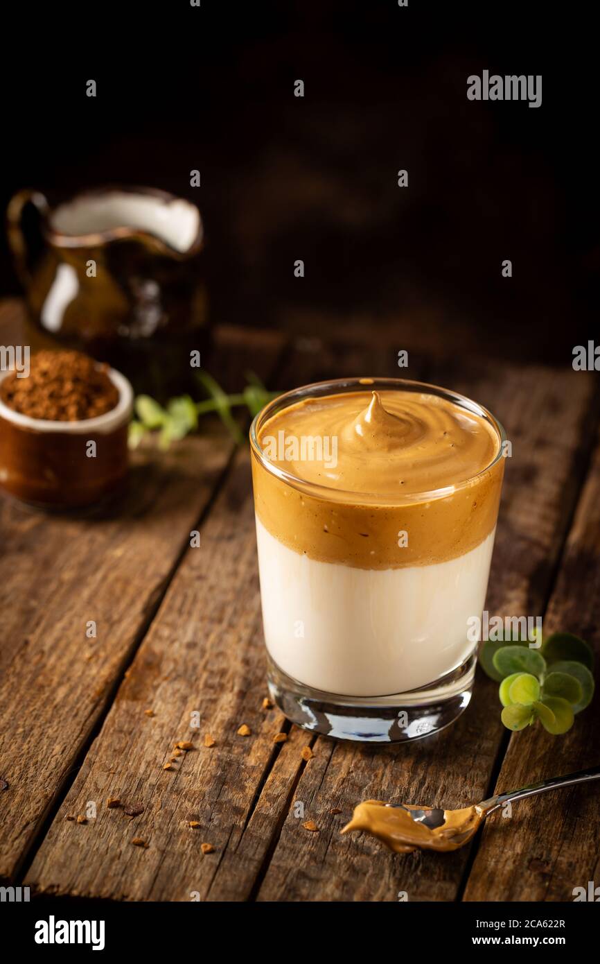 Dalgona Coffee, a cool fluffy whipped coffee in a glass. Latte espresso ...