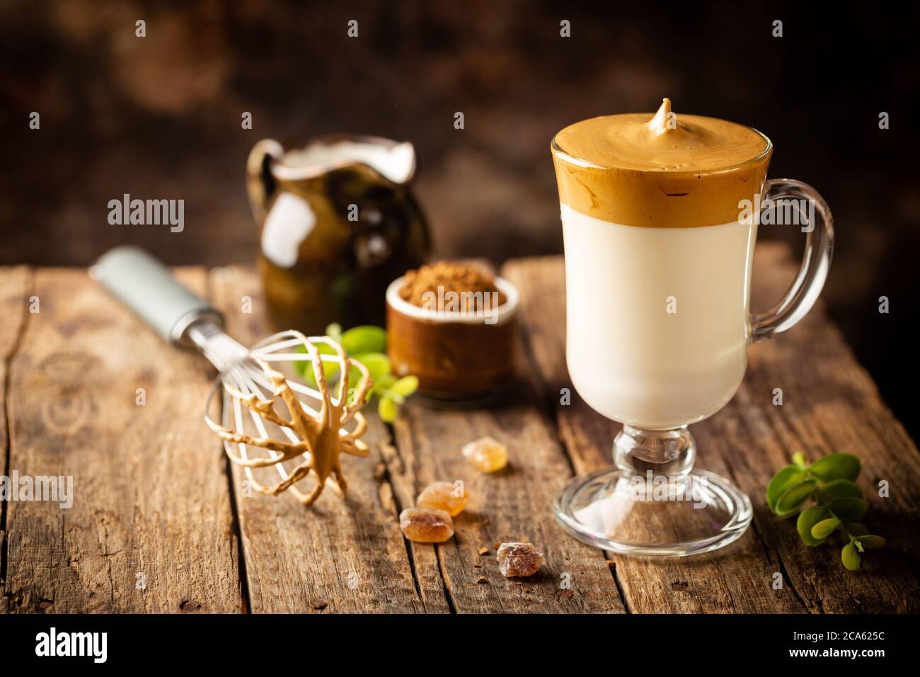 Dalgona Coffee, a cool fluffy whipped coffee in a glass. Latte espresso ...