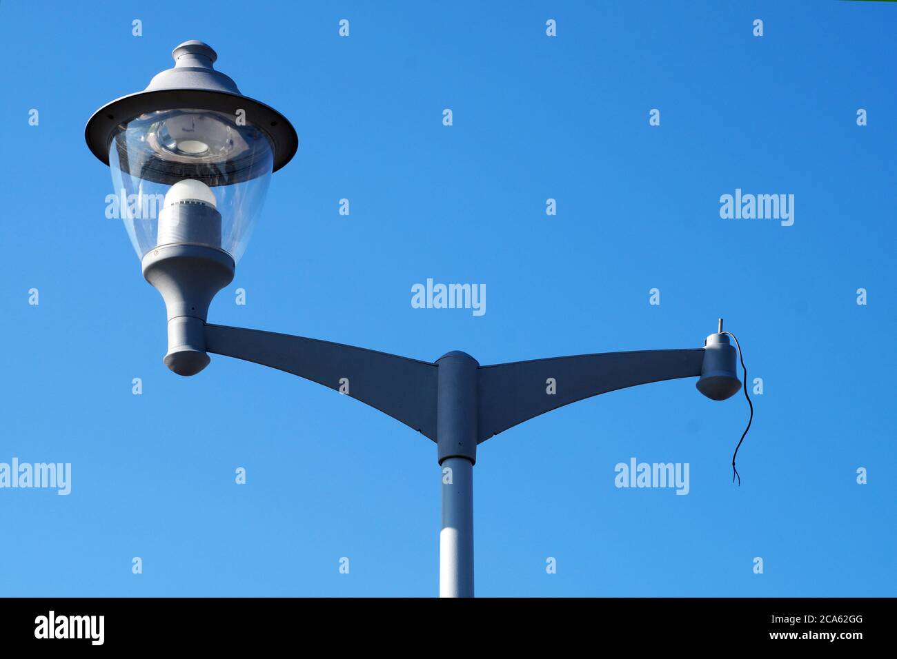 street lamp with one intact and one broken lamp close up Stock Photo ...
