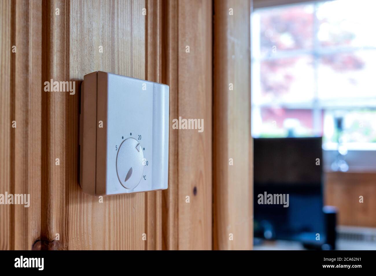 wall mounted analogue indoor thermostat at 20°C Stock Photo - Alamy