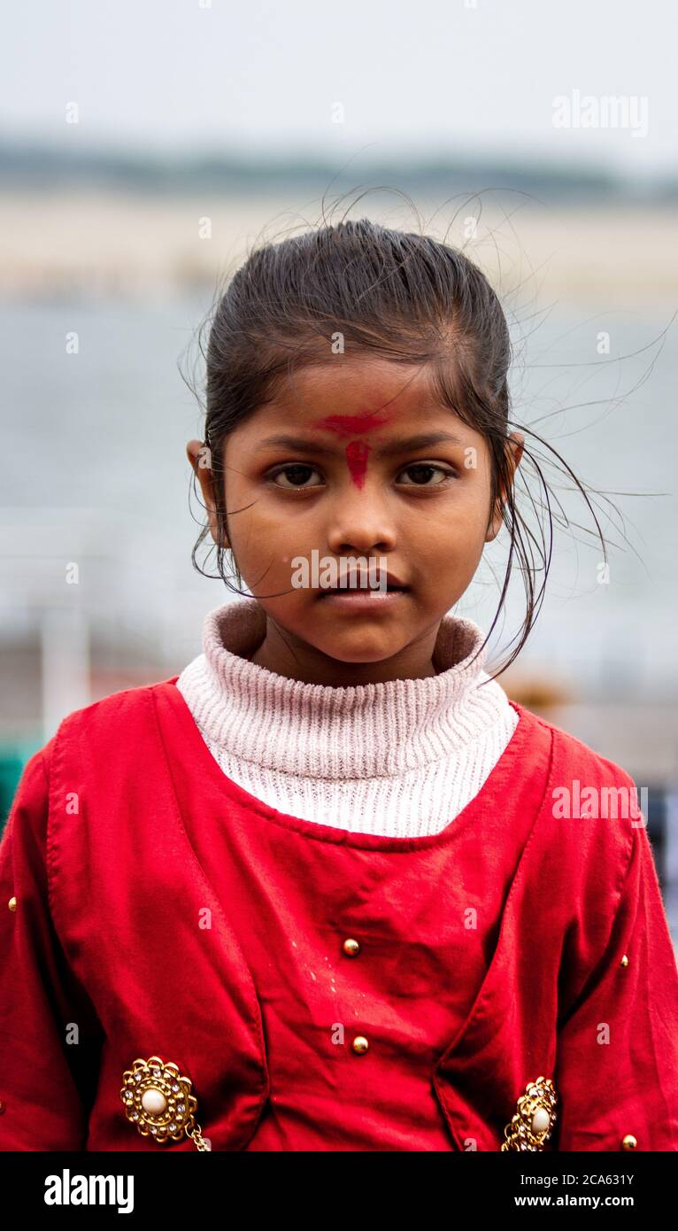 kid on a ghat close to the ganges river, Varanasi, Uttar Pradesh, India ...