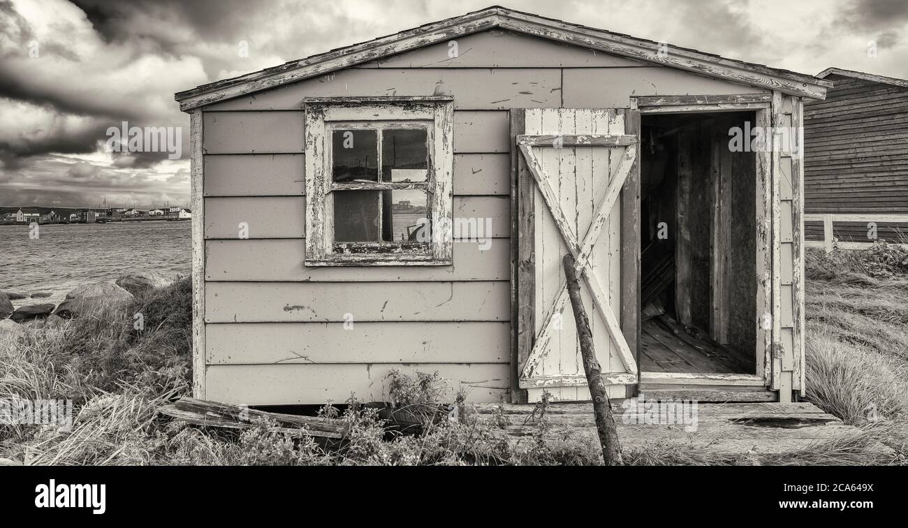 View of fishing stage on sea coastline, Tilting, Fogo Island ...