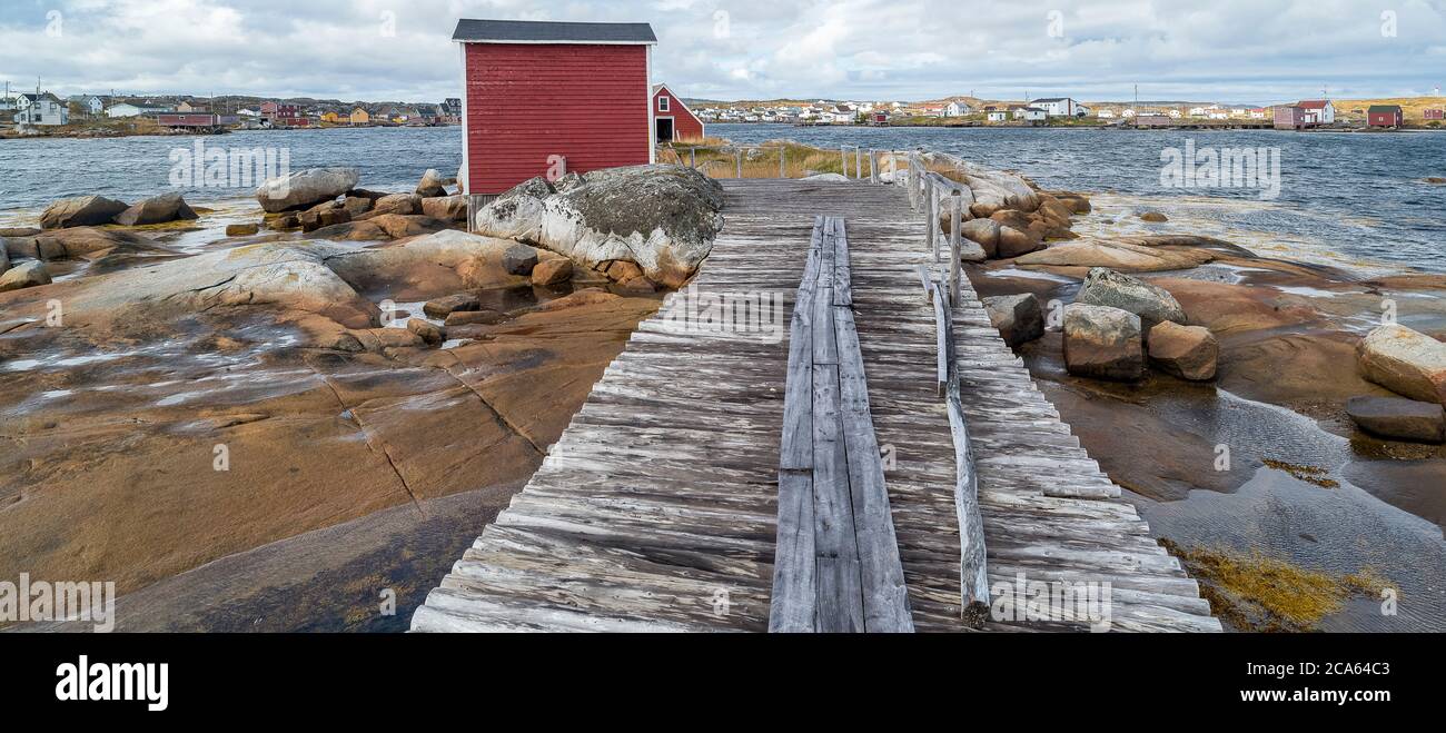View of fishing stage on sea coastline, Tilting, Fogo Island ...