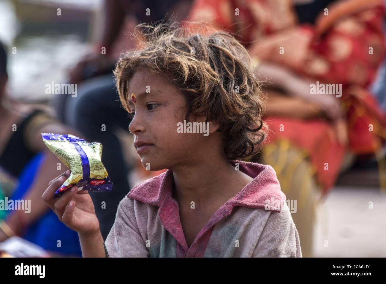 kid on a ghat close to the ganges river, Varanasi, Uttar Pradesh, India ...