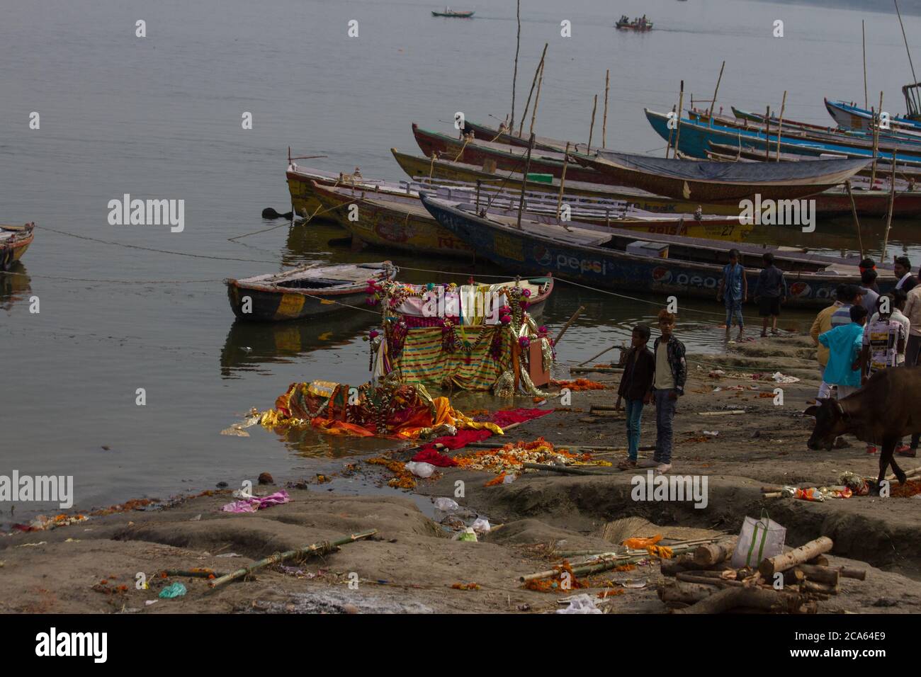 Cremation of bodies, on the burning ghat, on the banks of Ganges river ...