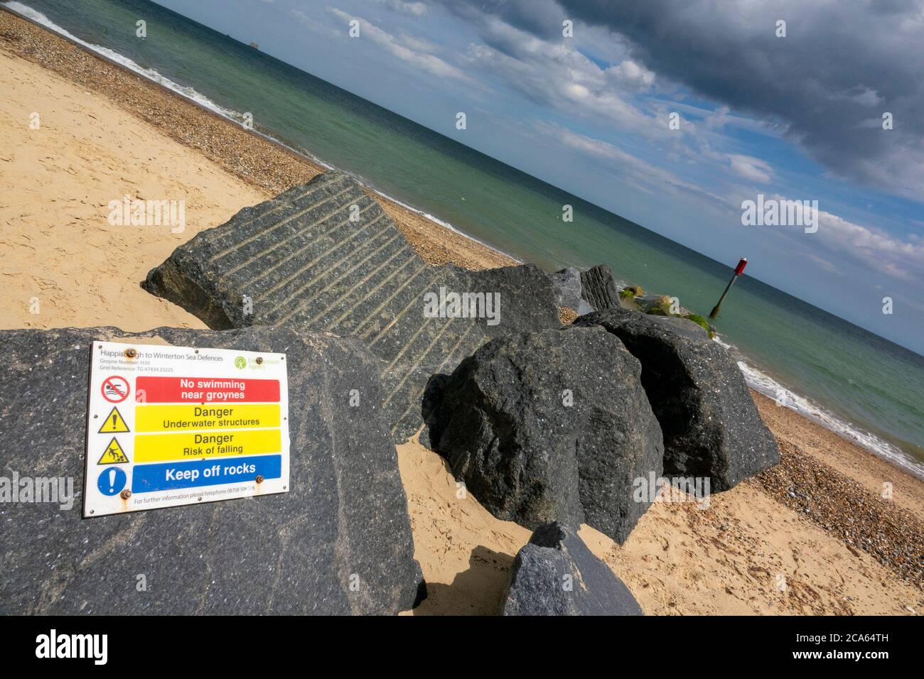 Rock groyne, sea defense Stock Photo - Alamy