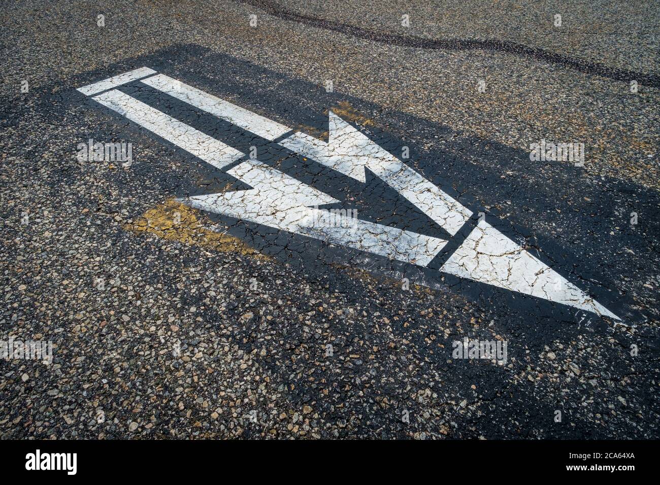Painted arrow on parking lot hi-res stock photography and images - Alamy
