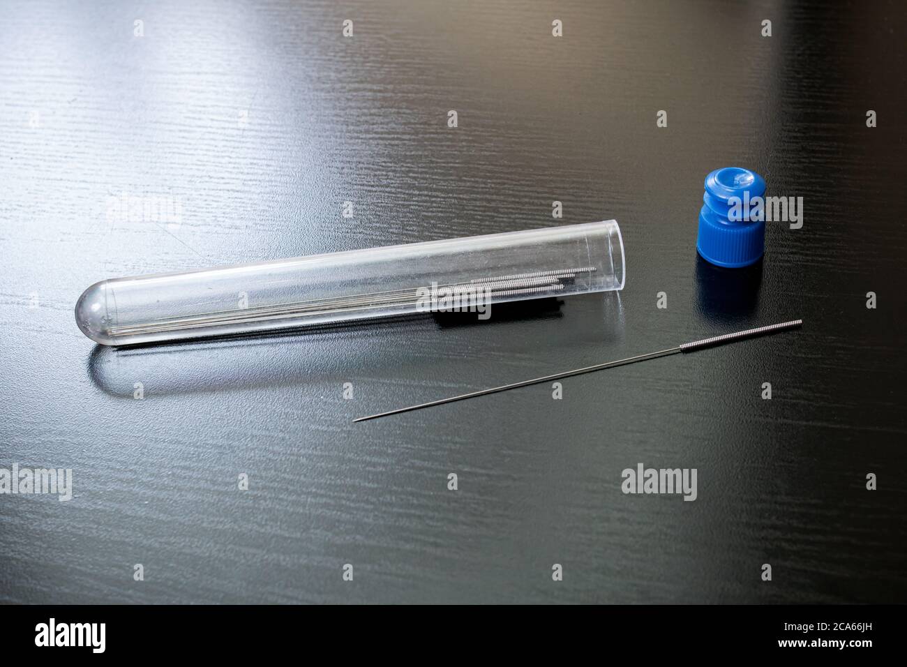 Long thin needles in a test tube Stock Photo - Alamy