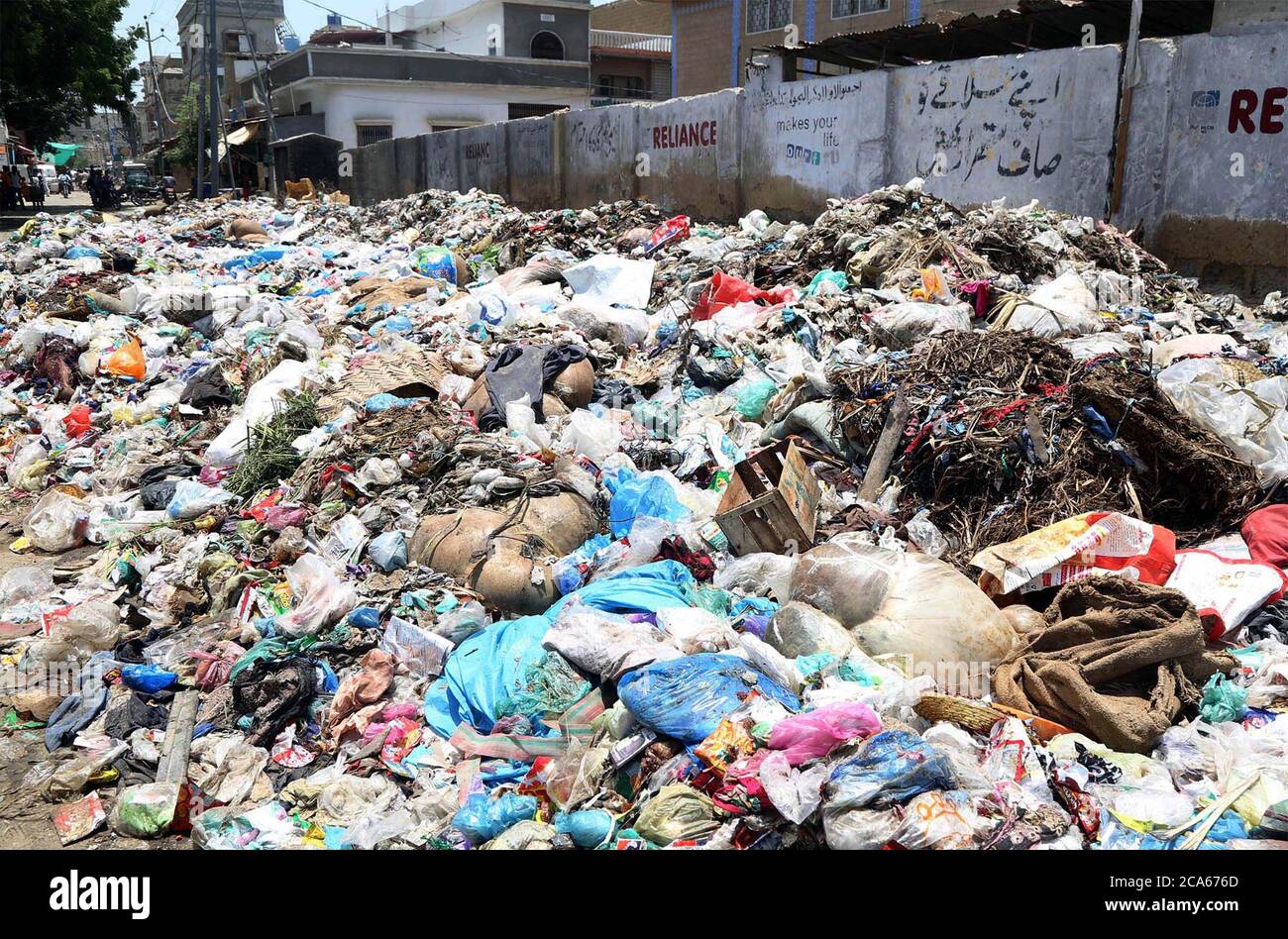 Huge heap of garbage and animal guts creating unhygienic atmosphere and ...