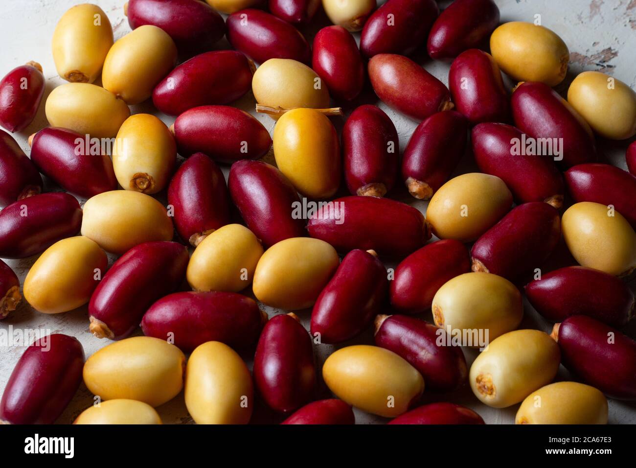 yellow fresh dates fruit on white background Stock Photo - Alamy