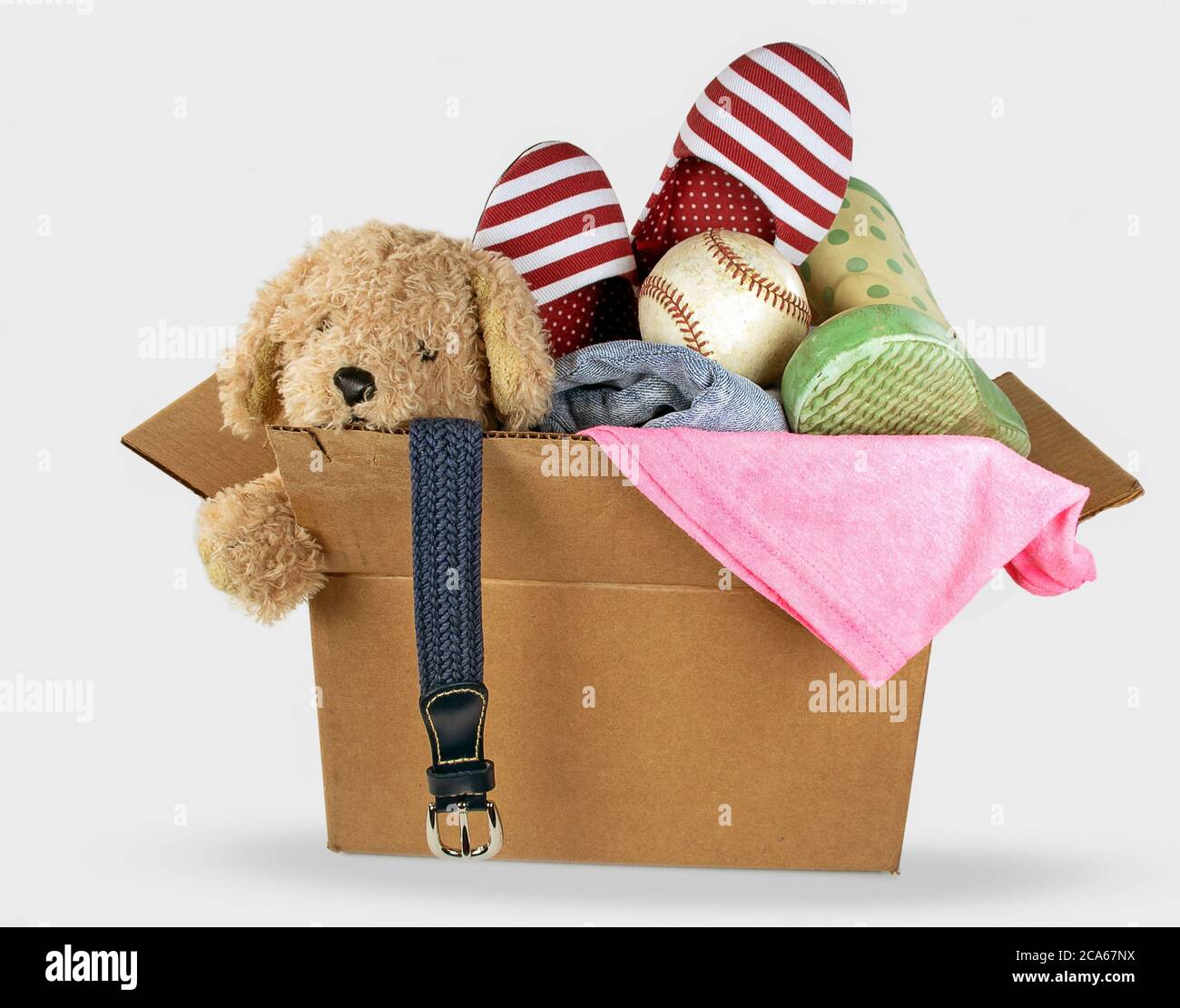 brown cardboard box filled with donated items for charity isolated on ...