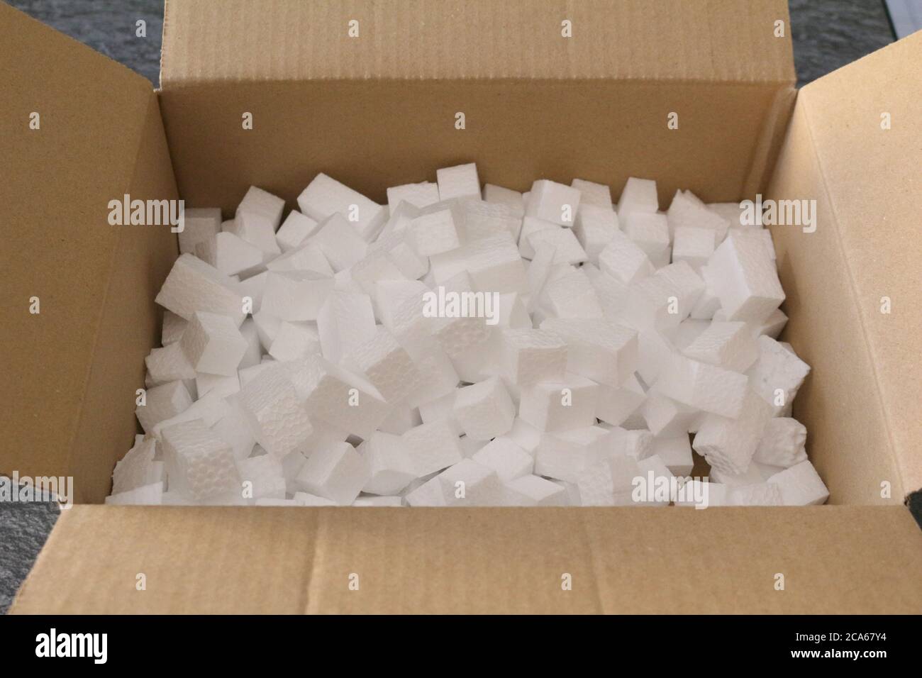 Cardboard box containing pieces of polystyrene for packaging Stock ...