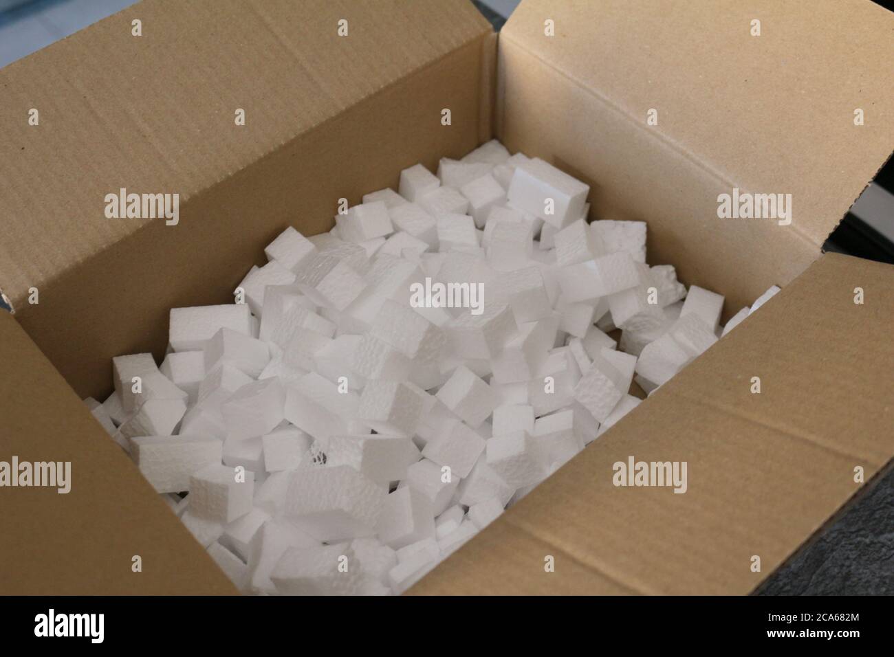 Cardboard box containing pieces of polystyrene for packaging Stock ...