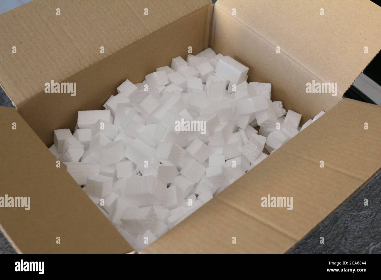 Cardboard box containing pieces of polystyrene for packaging Stock ...