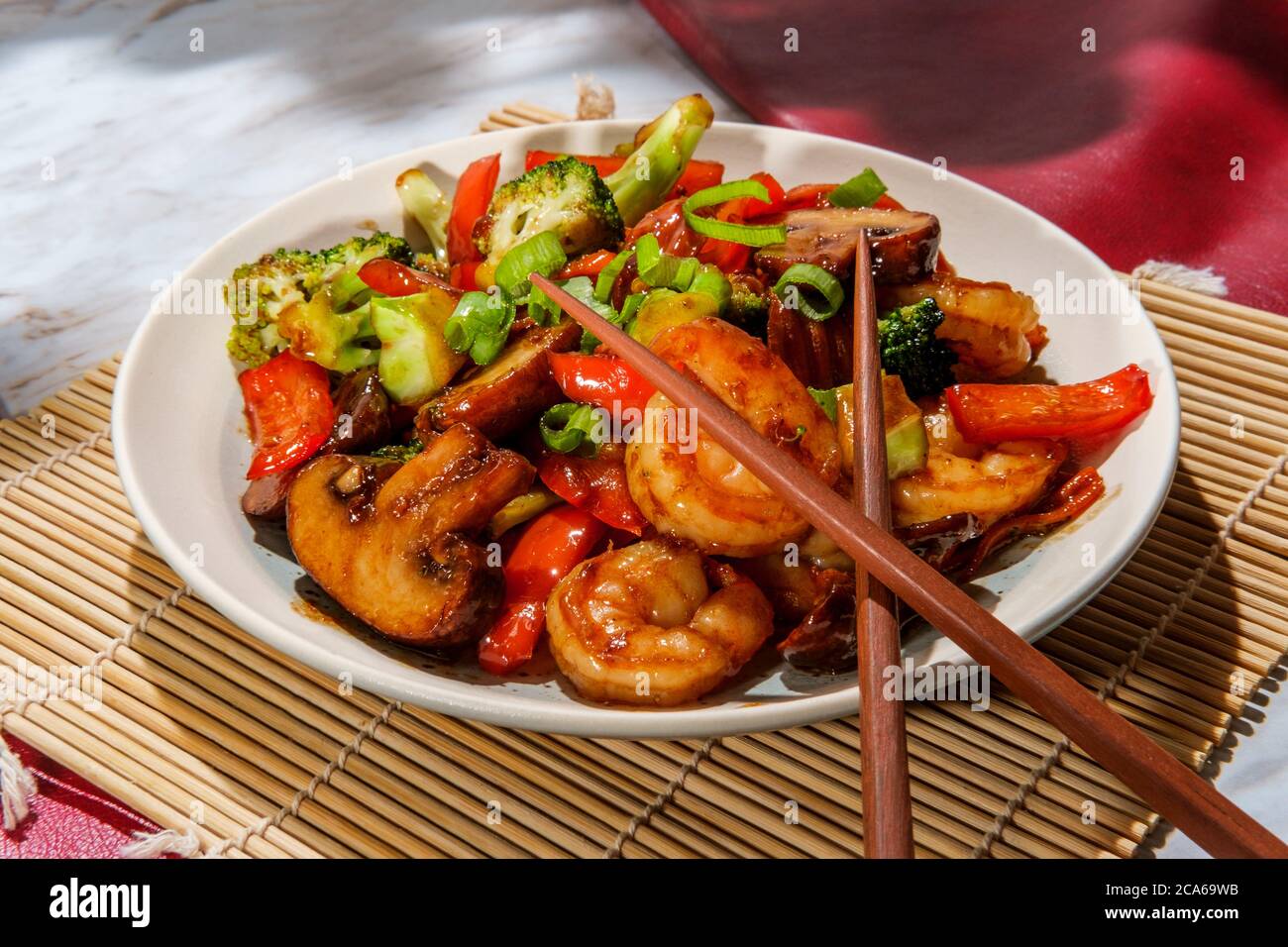 Chinese shrimp with mixed sauteed vegetables in a brown garlic sauce ...