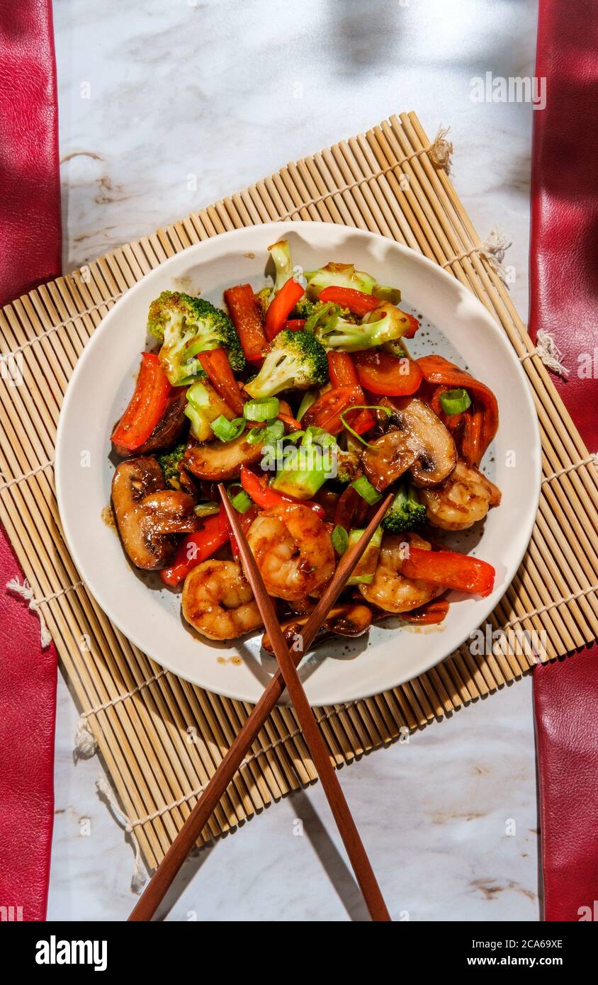 Chinese shrimp with mixed sauteed vegetables in a brown garlic sauce ...