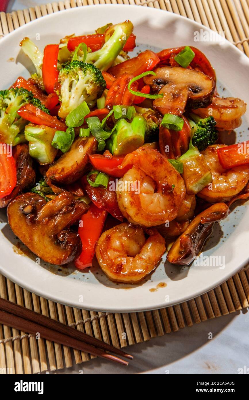 Chinese shrimp with mixed sauteed vegetables in a brown garlic sauce ...