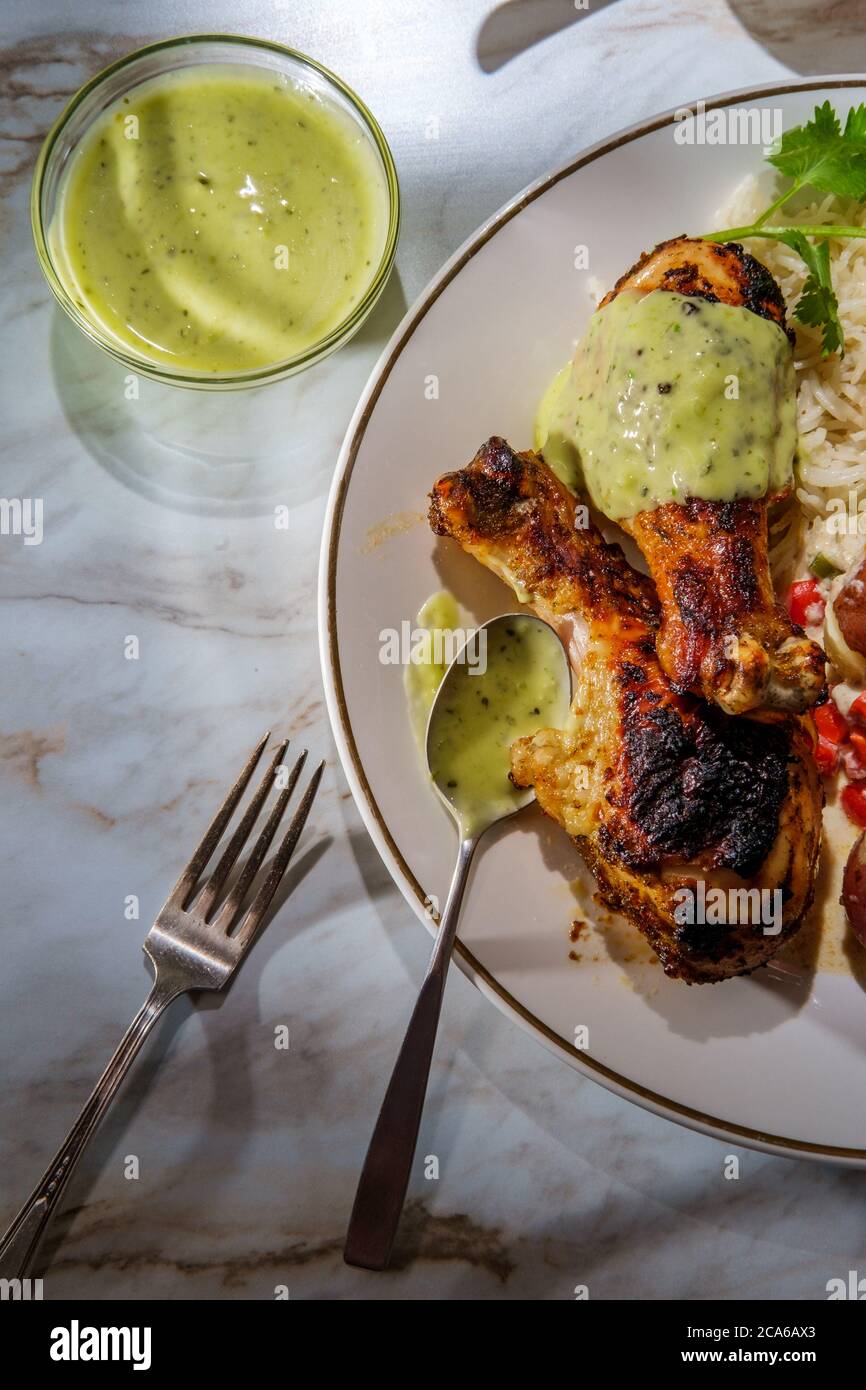 Colombian cuisine papas chorreadas roasted chicken legs and rice Stock ...