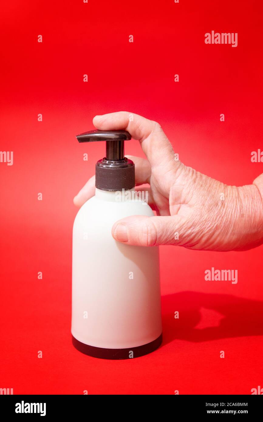 Woman push liquid soap squeezed out to hand Stock Photo - Alamy