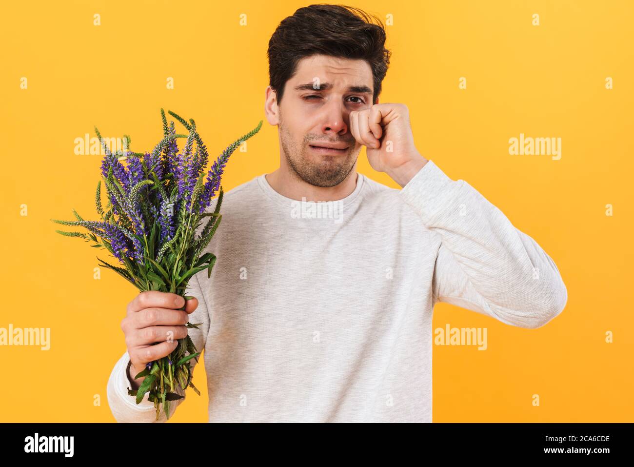 Photo of handsome unhappy man with allergy crying and posing with ...