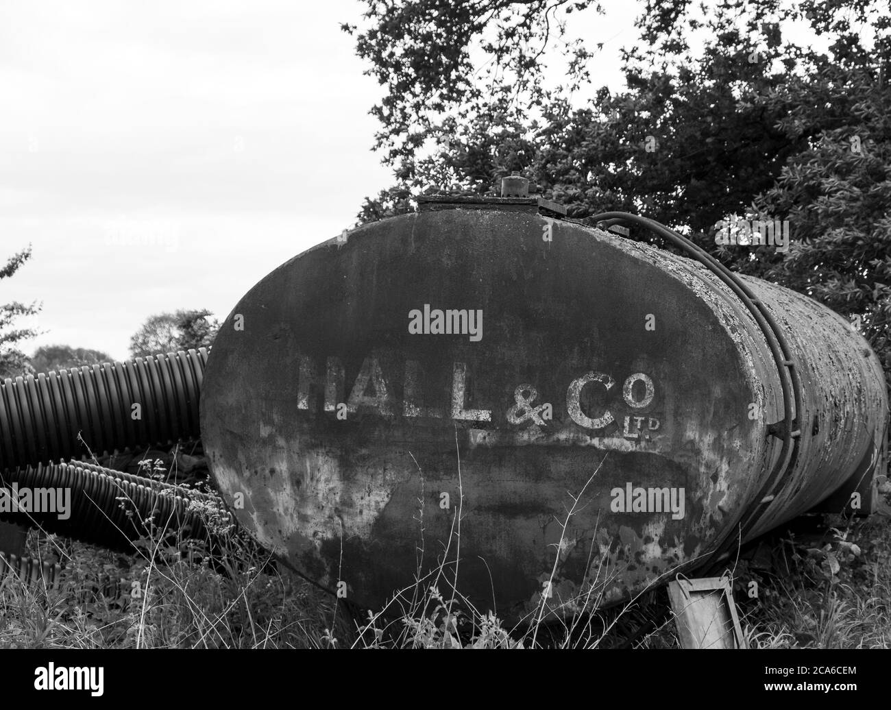 Old rusty oil tank in a scrapyard Stock Photo - Alamy